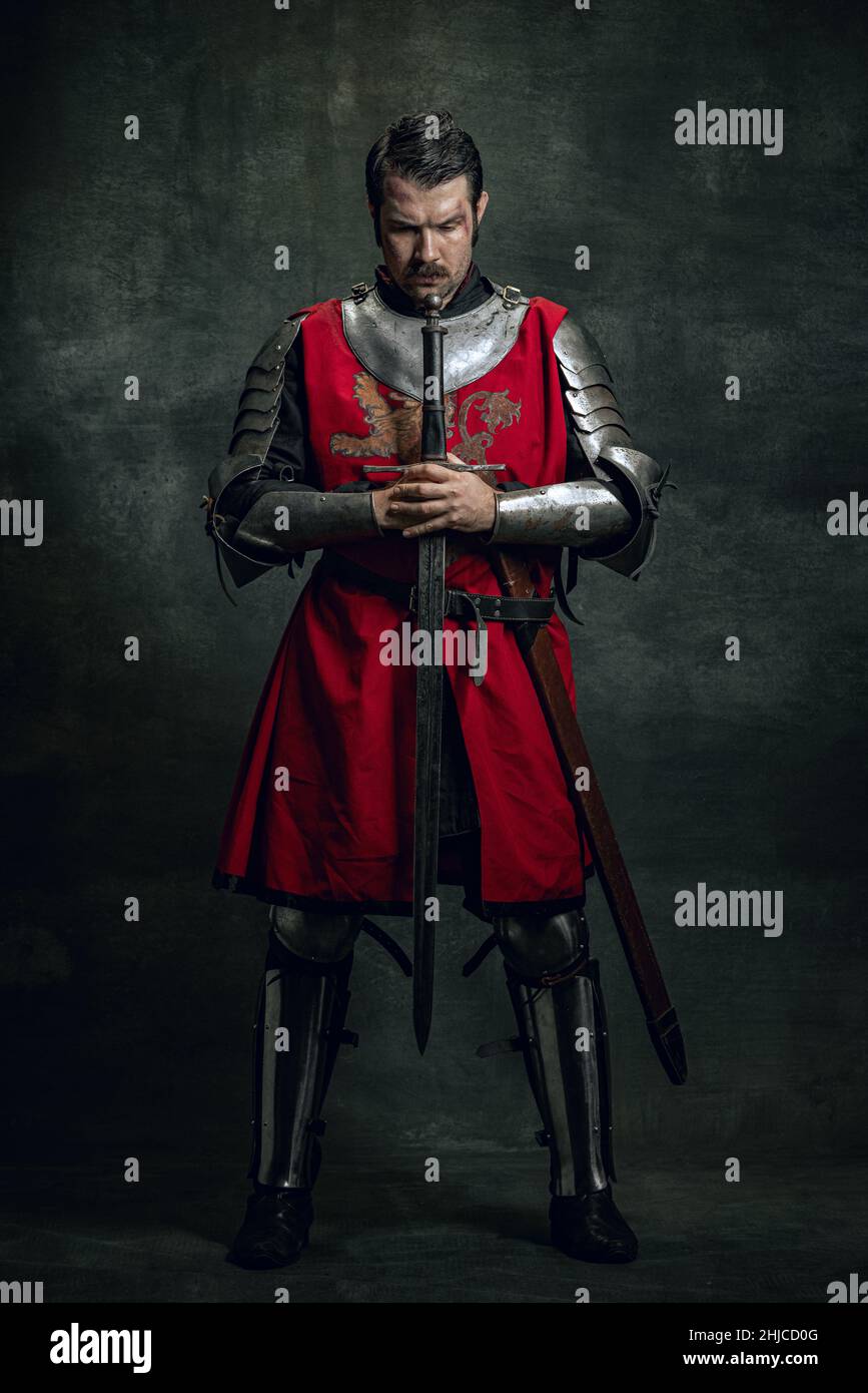 Portrait of brutal seriuos man, medieval warrior or knight with dirty ...