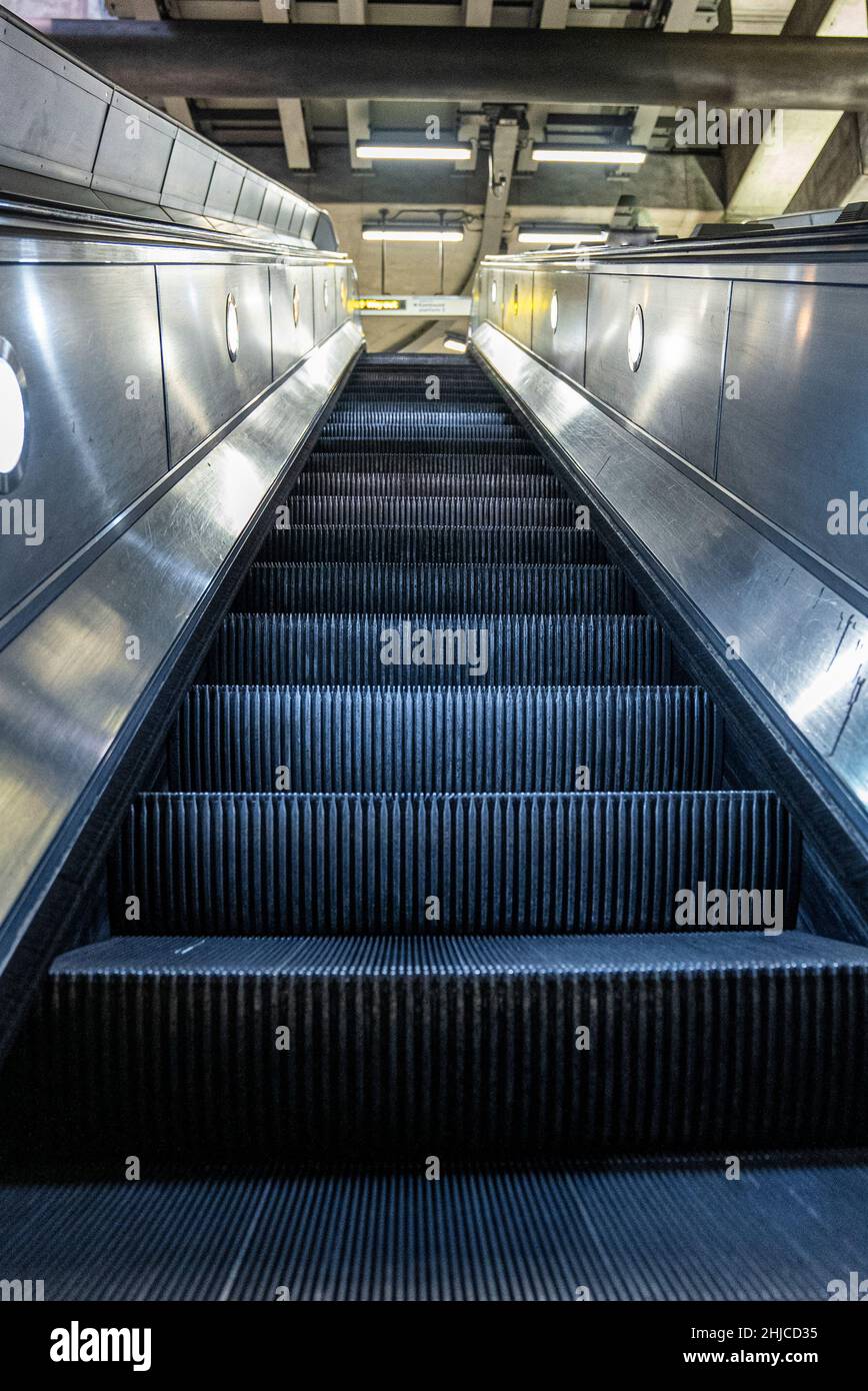 Long empty elevator with illuminated lights at modern subway station ...
