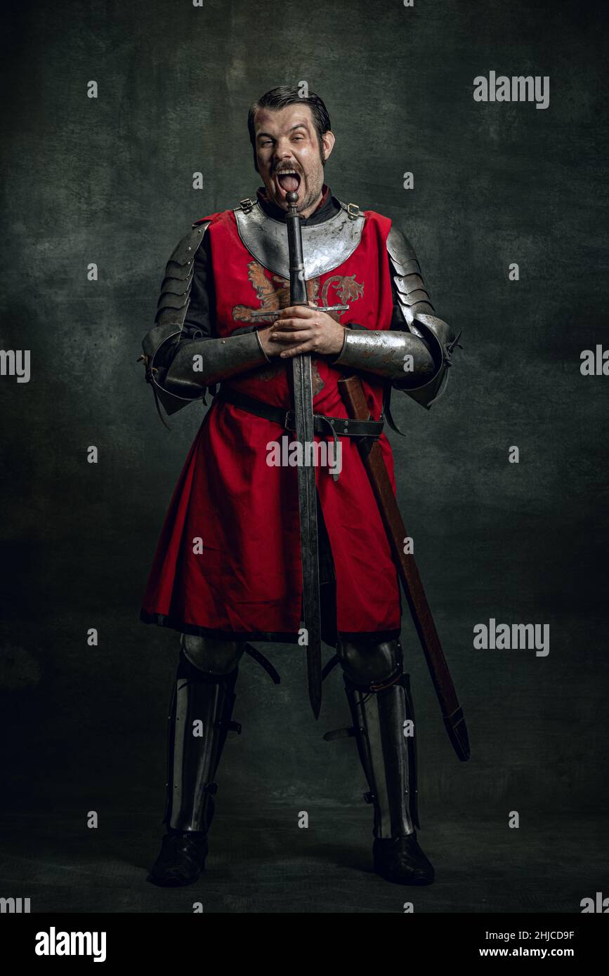 Comic portrait of funny medieval warrior or knight with dirty wounded ...