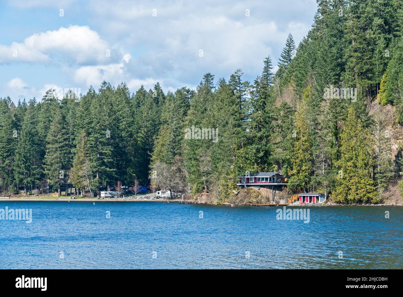 Lake overview with camp ground and water front residential house Stock ...