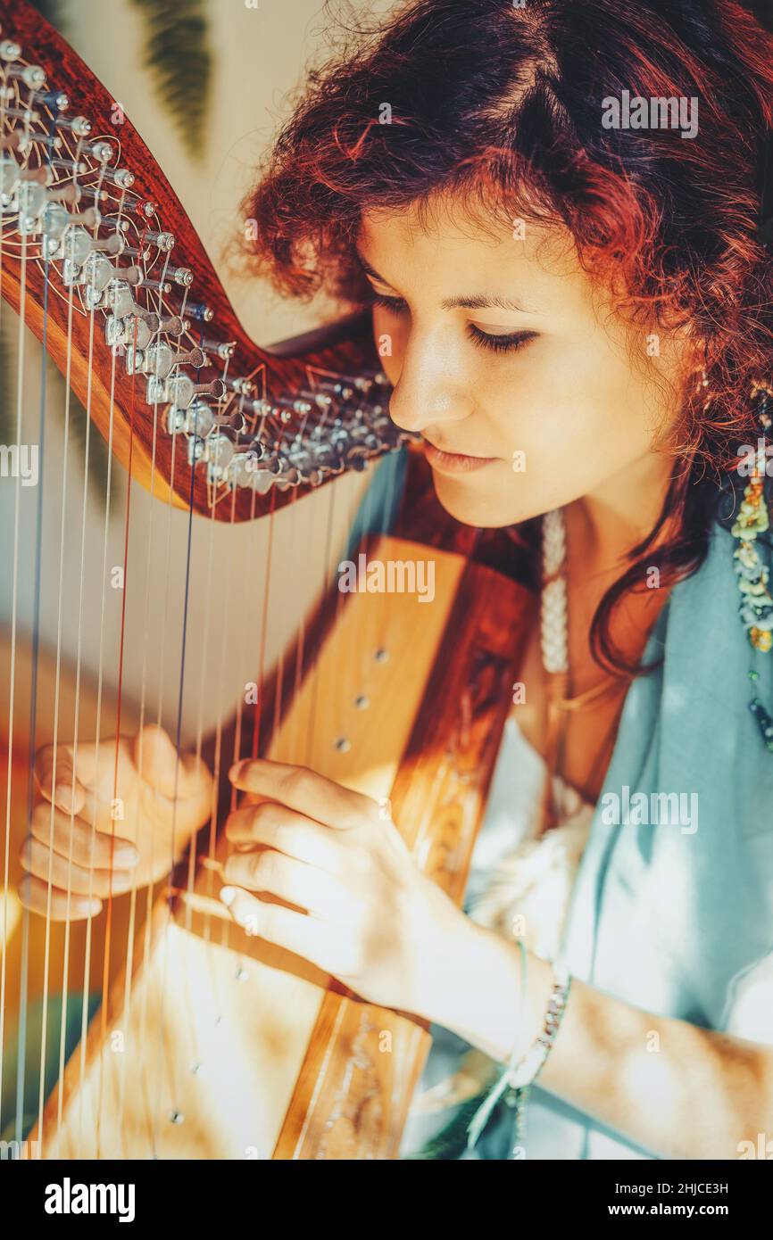 Female woman girl harpist harp playing hi-res stock photography and ...