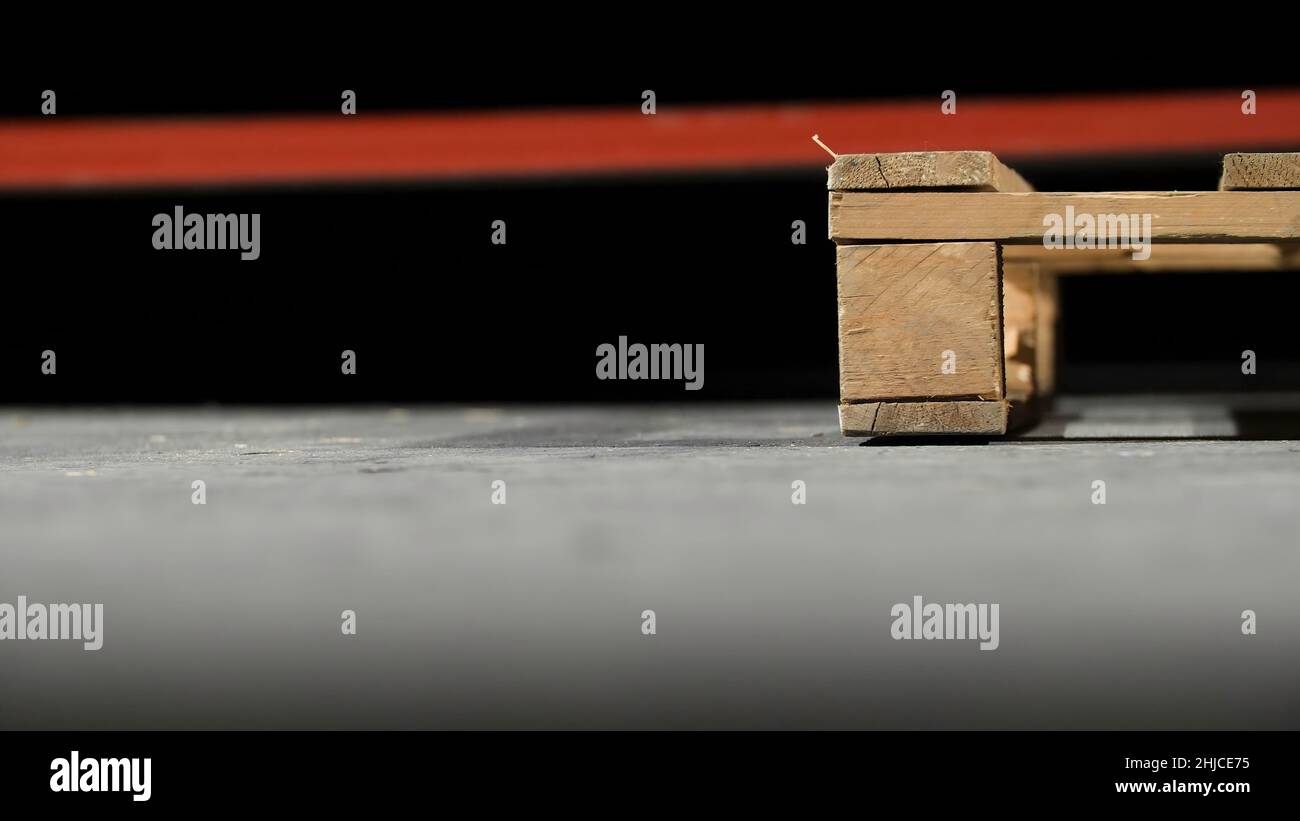 Close-up of wooden pallet. Angle of wooden pallet on grey concrete ...