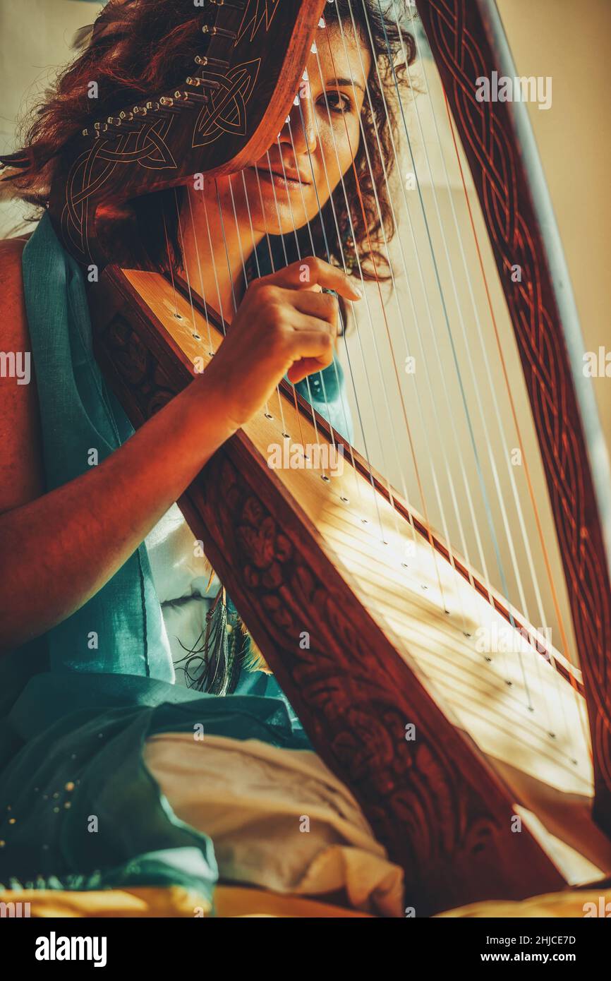 Female woman girl harpist harp playing hi-res stock photography and ...