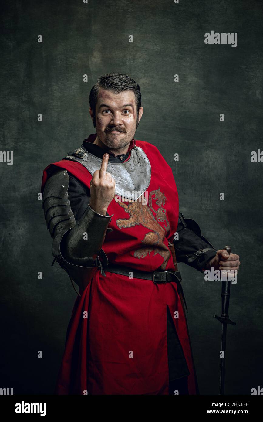 Comic portrait of funny medieval warrior or knight with dirty wounded ...