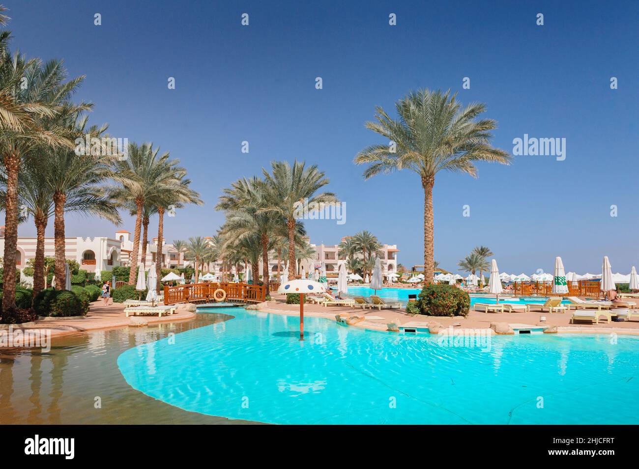 Beautiful swimming pool and palm trees in Egypt Stock Photo - Alamy