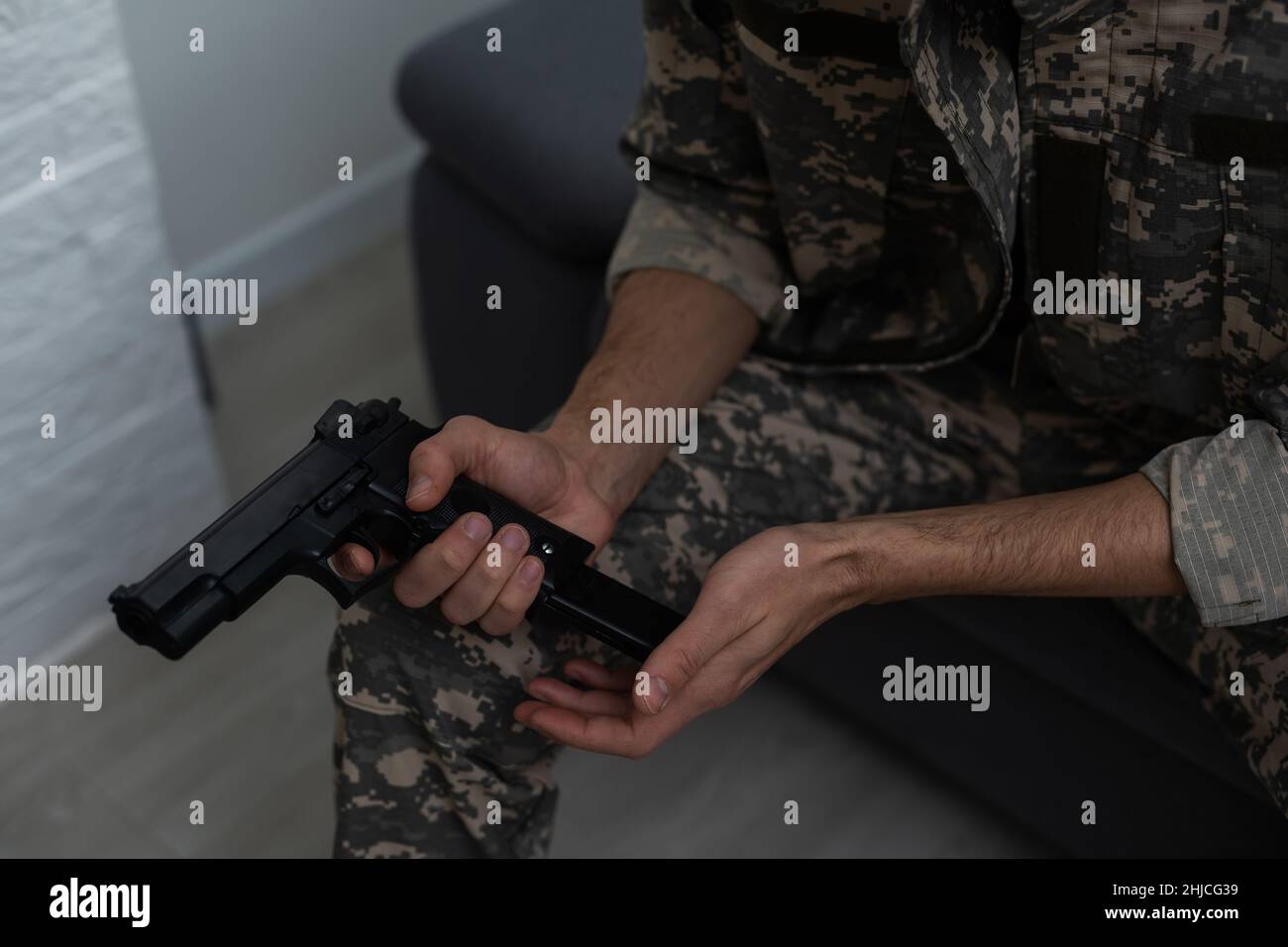 military man with a gun Stock Photo - Alamy