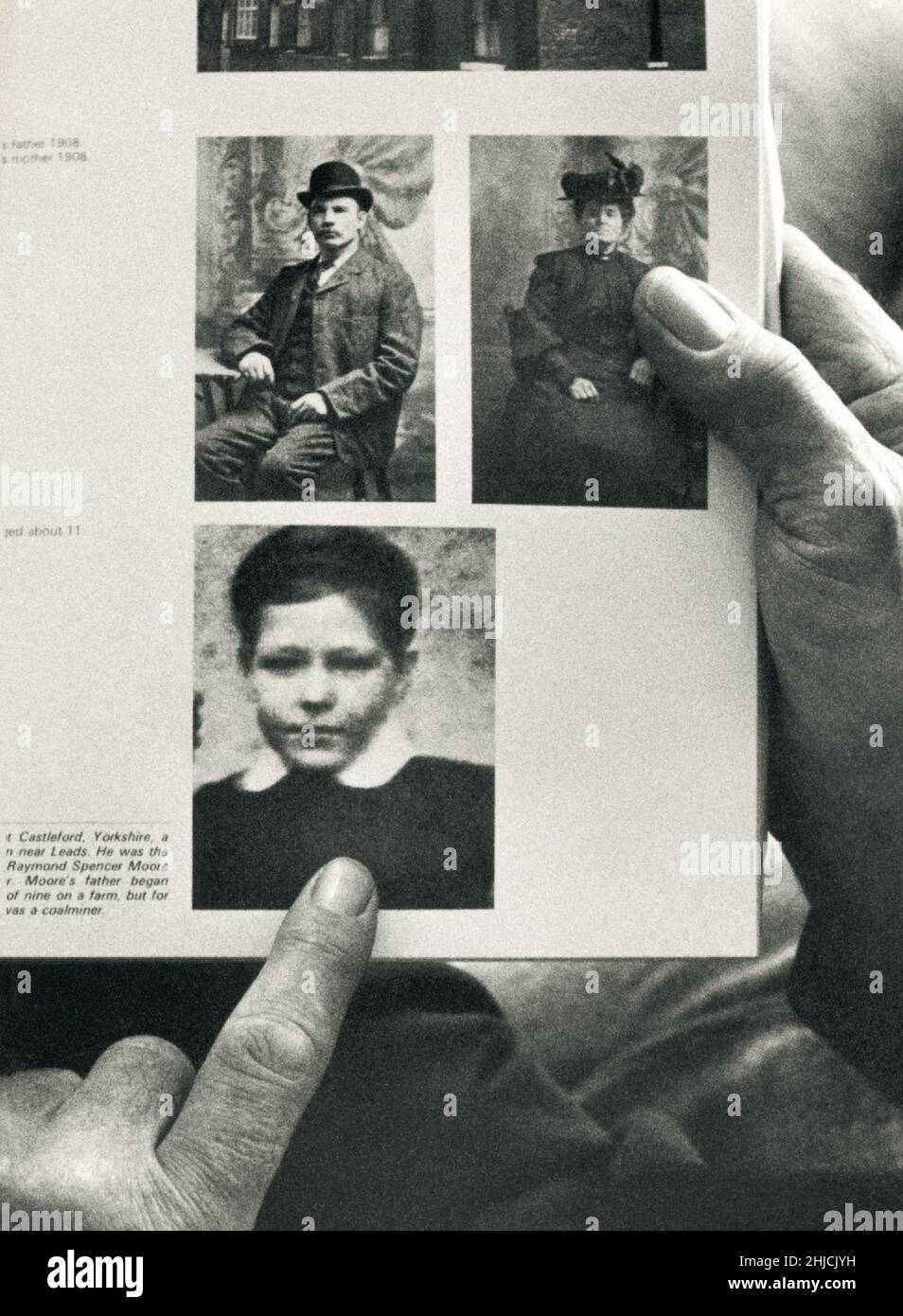 Sir Henry Spencer Moore points to a boyhood picture of himself, while ...