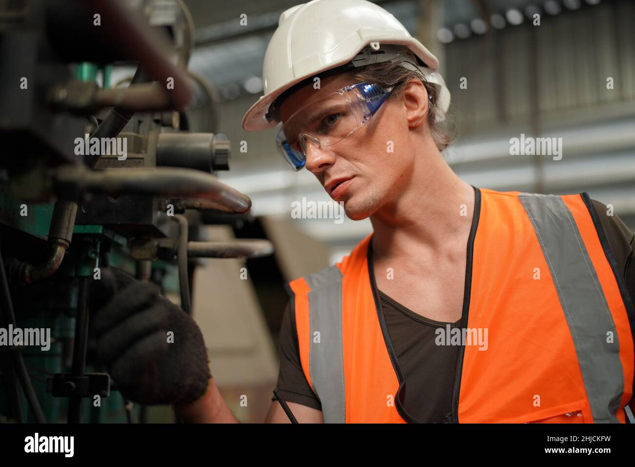 Industrial Engineers in Hard Hats.Work at the Heavy Industry Manufacturing Factory. Industrial ...