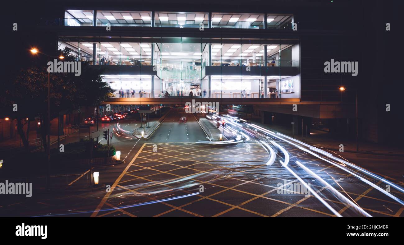 Building with glass walls and lights at night Stock Photo - Alamy