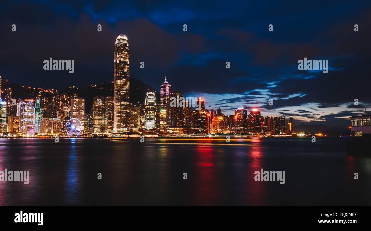 Modern glowing buildings on waterfront Stock Photo - Alamy
