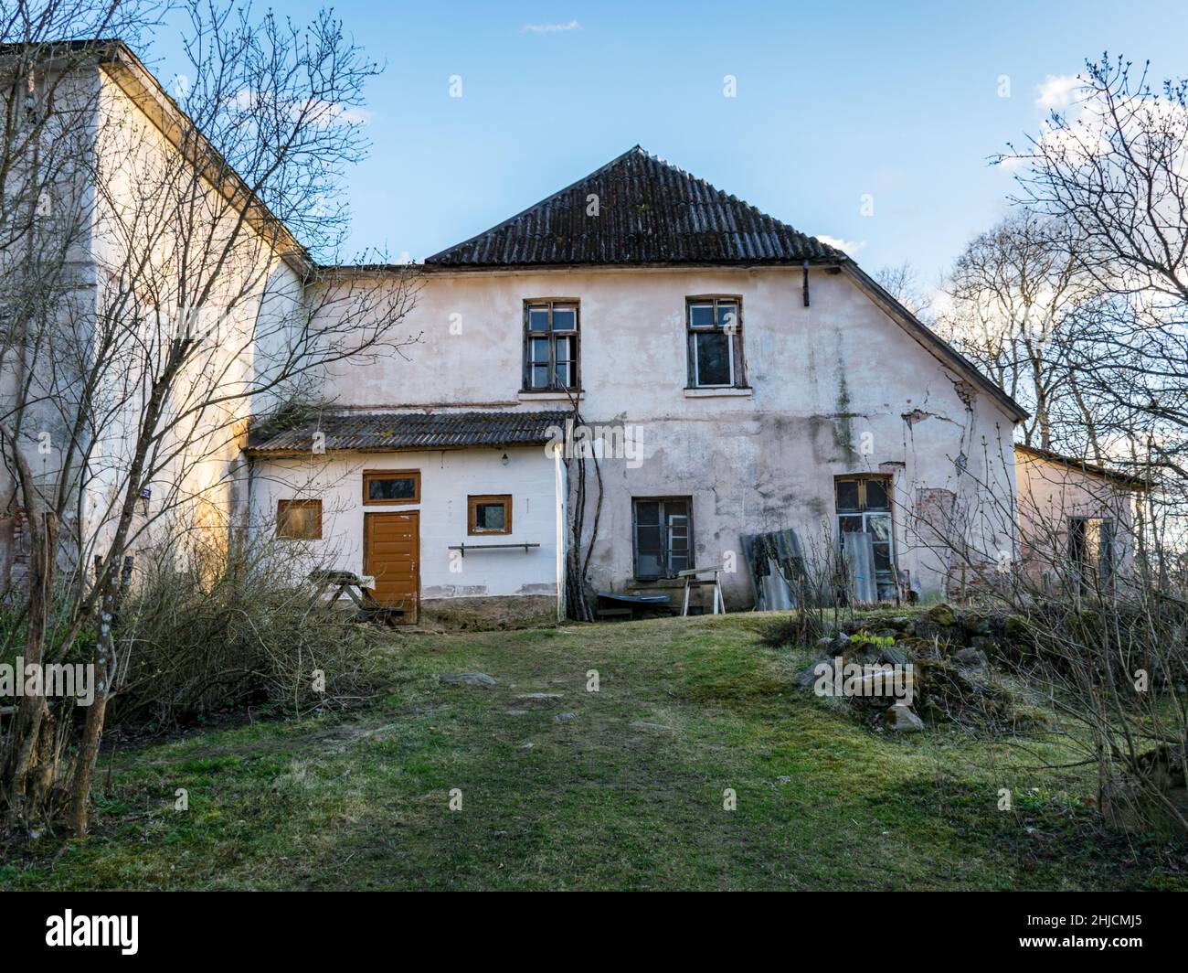 old manor house surrounded by trees, partially inhabited, old Augstroze ...