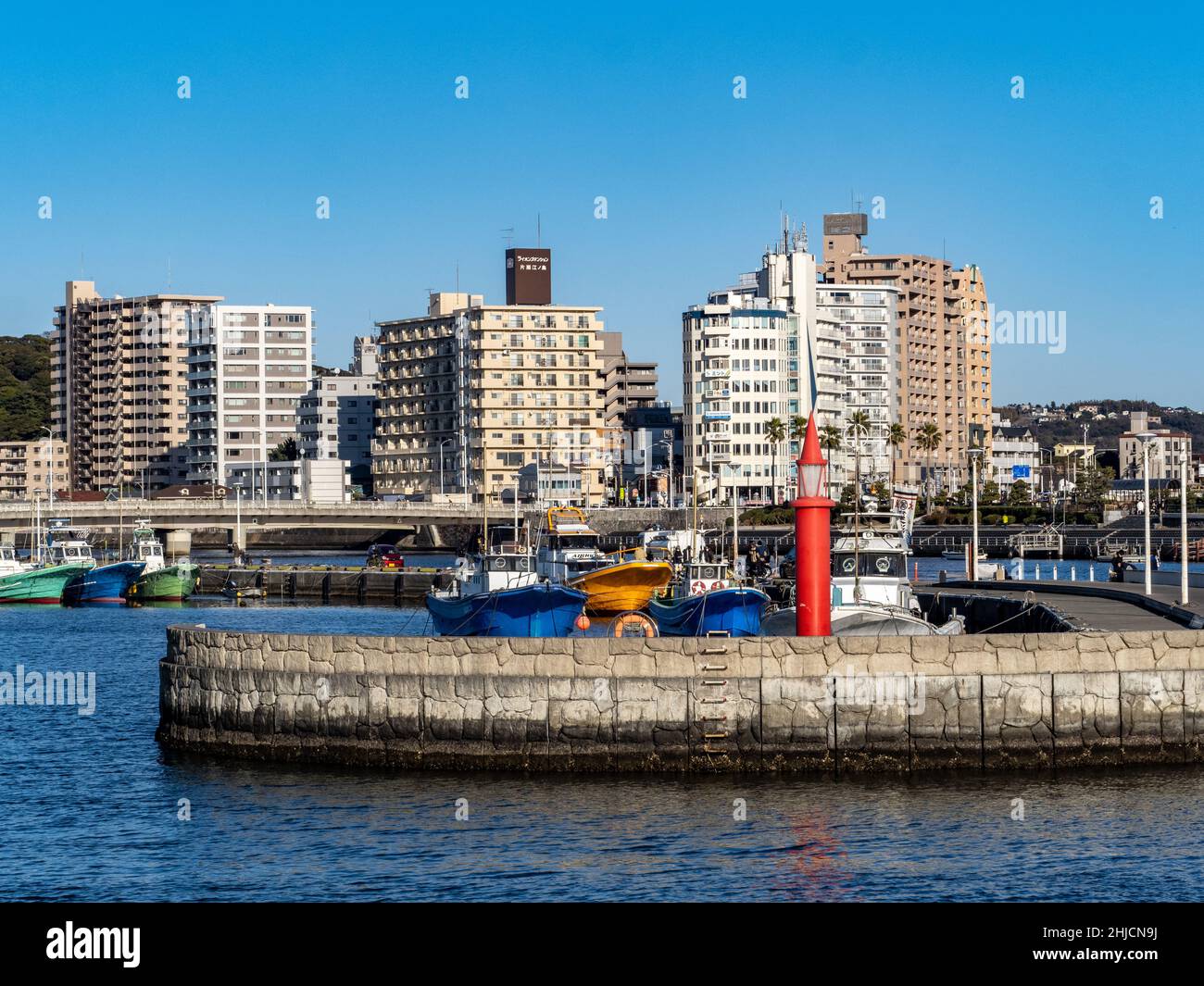 Perspective shot of some boats in the background of a cityscape Stock ...