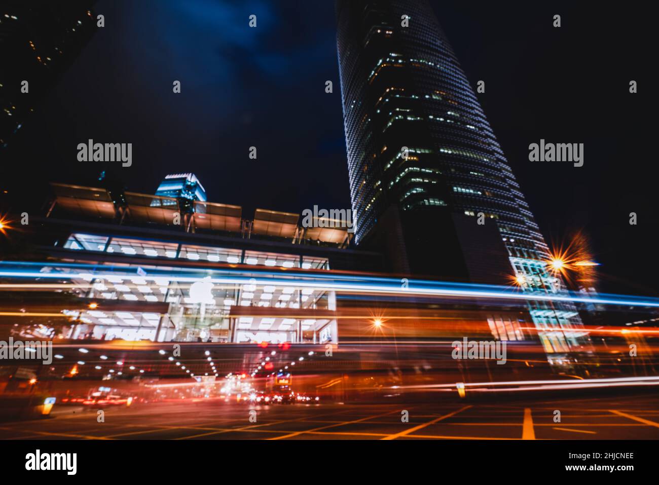 Skyscraper with glowing light at night Stock Photo - Alamy