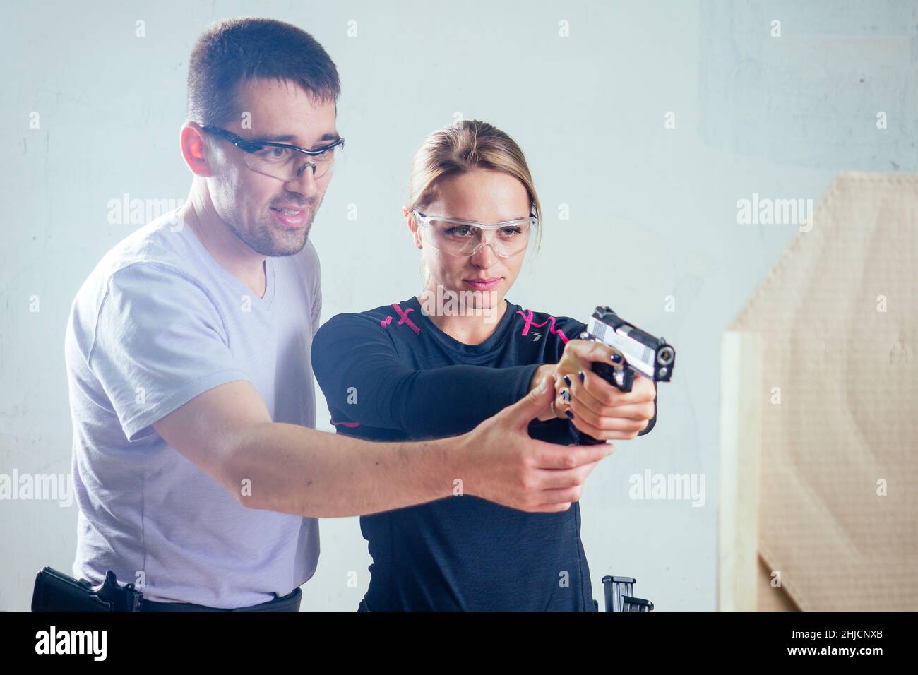 A person target practicing with a handgun for self defense Stock Photo ...