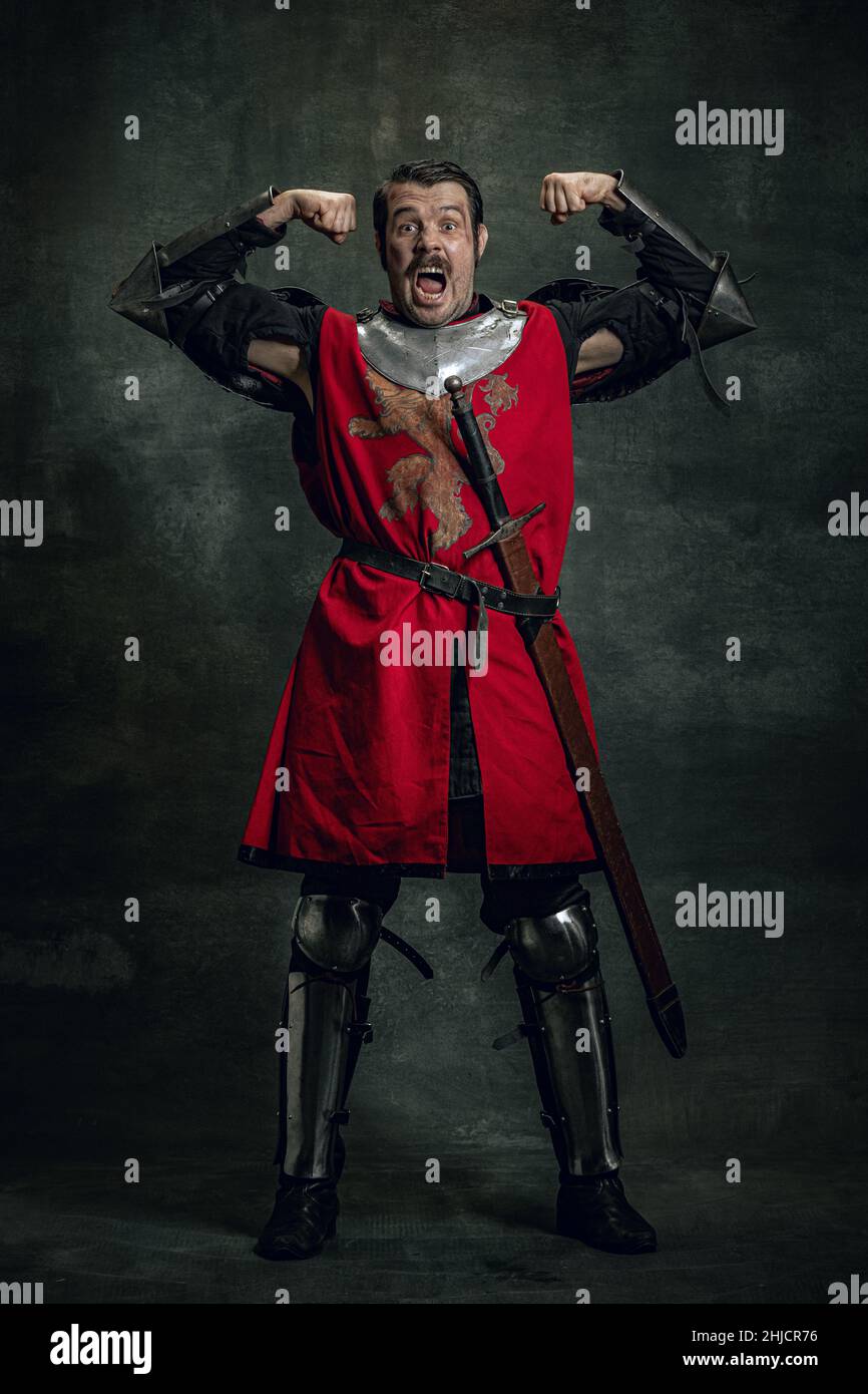 Comic portrait of funny medieval warrior or knight with dirty wounded ...