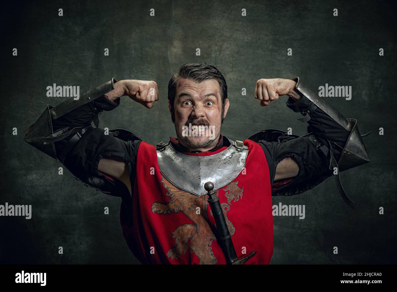 Portrait of brave medieval warrior or knight with dirty wounded face ...