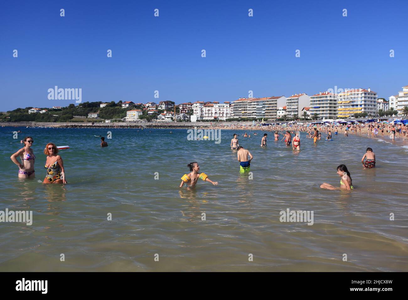 Busy beach in August at St Jean de Luz, Pyrenees Atlantiques, Pays ...