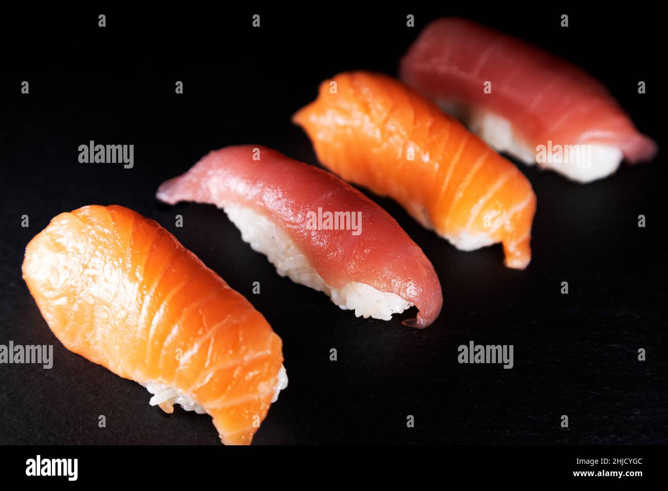 A platter of tuna and salmon nigiri. Types of sushi, the dish ...