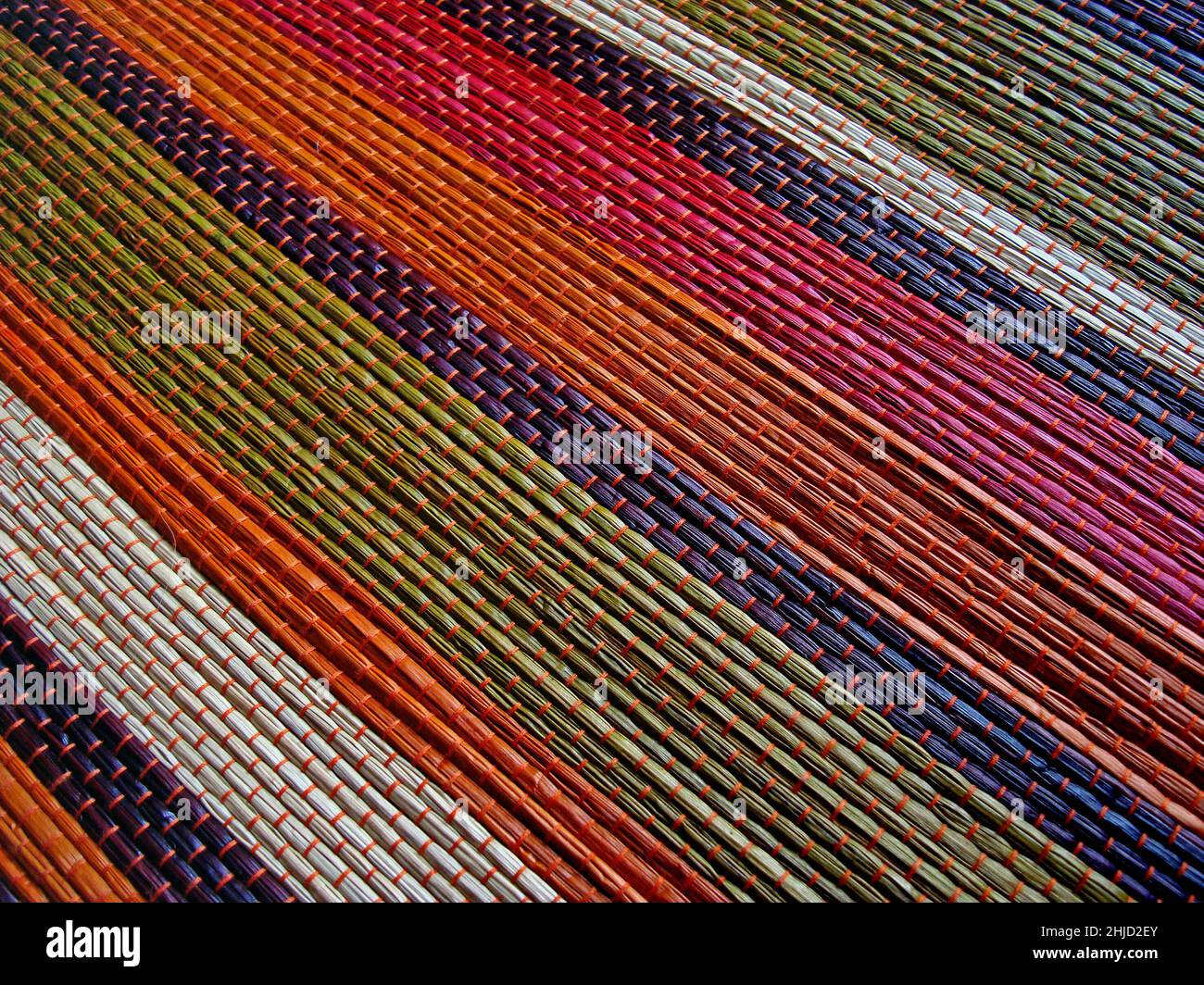 Handicraft with colorful striped straw Stock Photo - Alamy