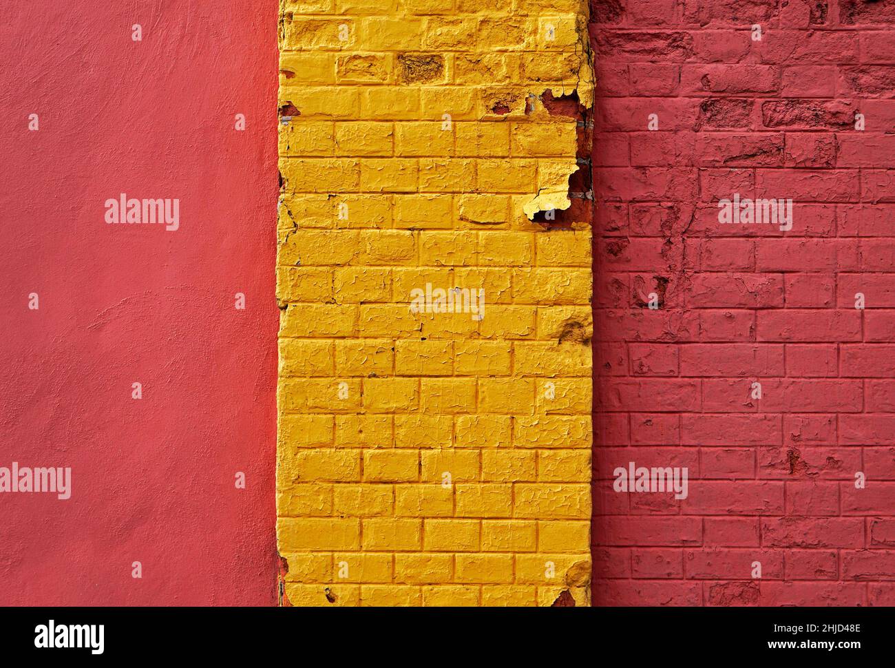 Red and yellow brick wall background Stock Photo - Alamy