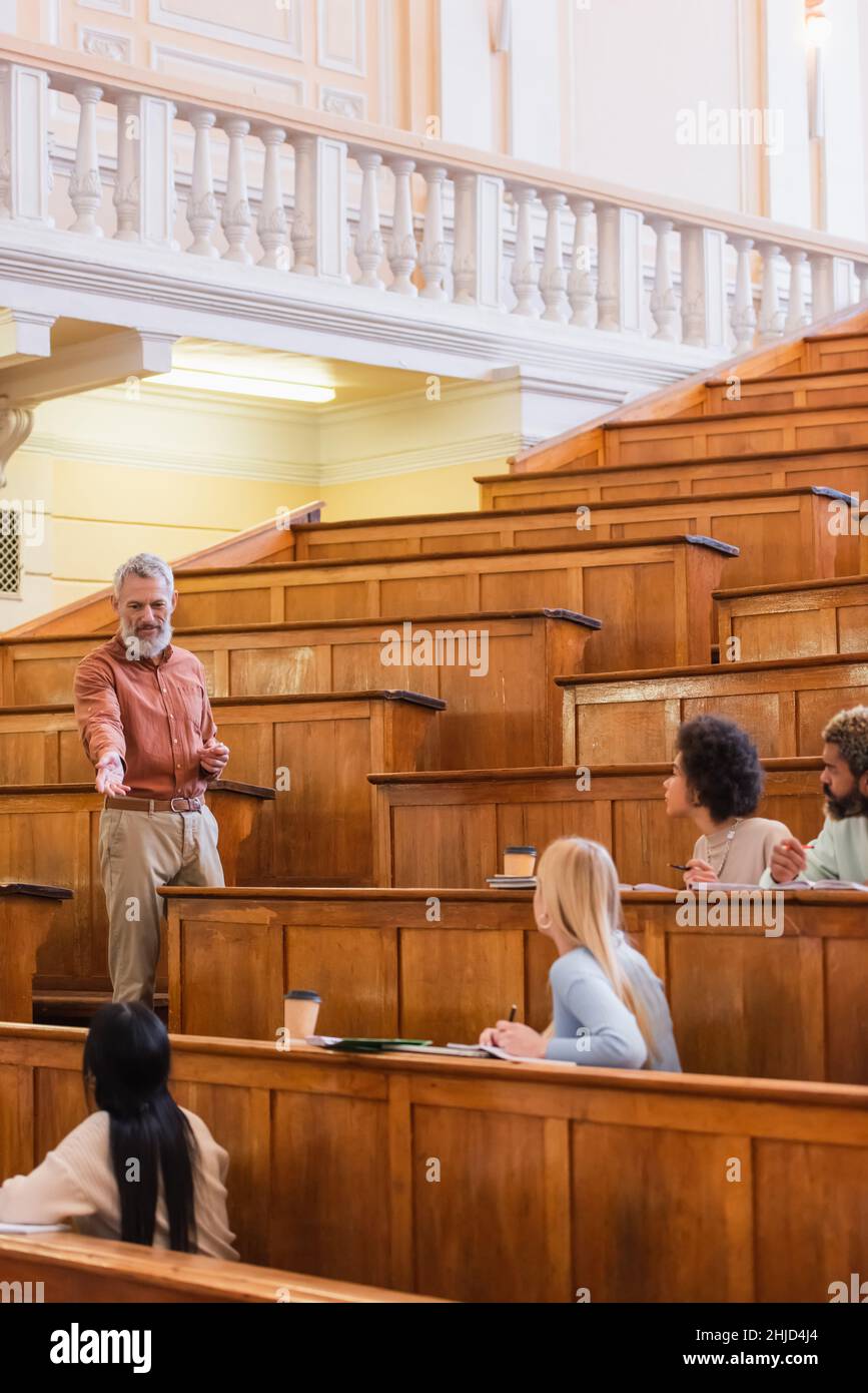 Professor pointing at student during lecture in university Stock Photo ...