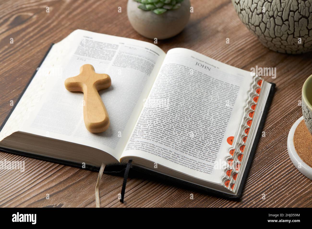Wooden cross and open Holy Bible on the table Stock Photo - Alamy