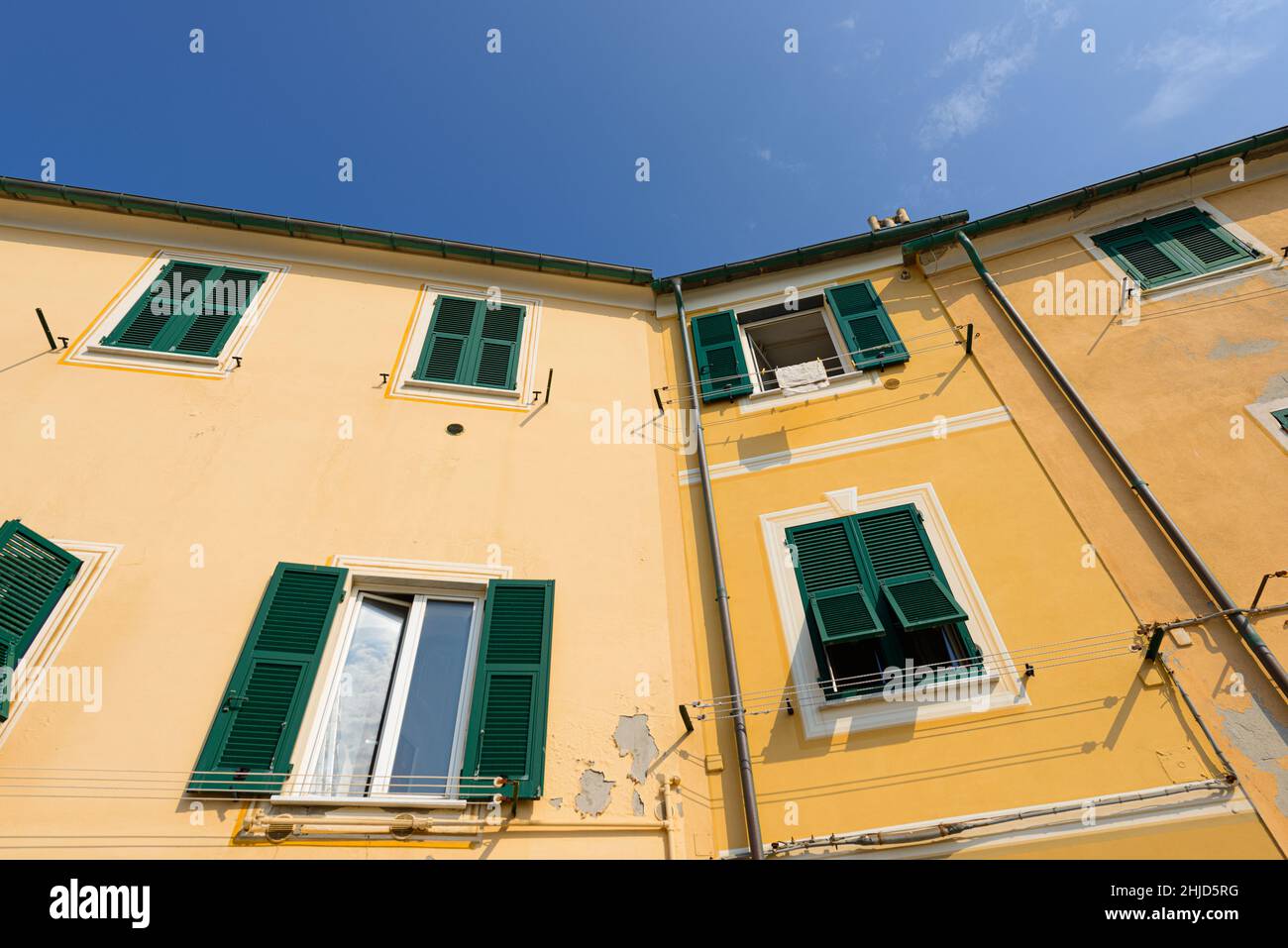 Traditional colors of the house, walls, doors, windows. Italy Stock ...
