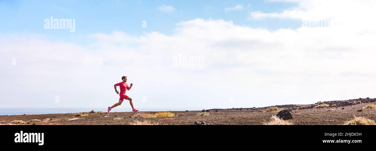 Athlete running man athlete on triathlon run. Hero profile view of ...