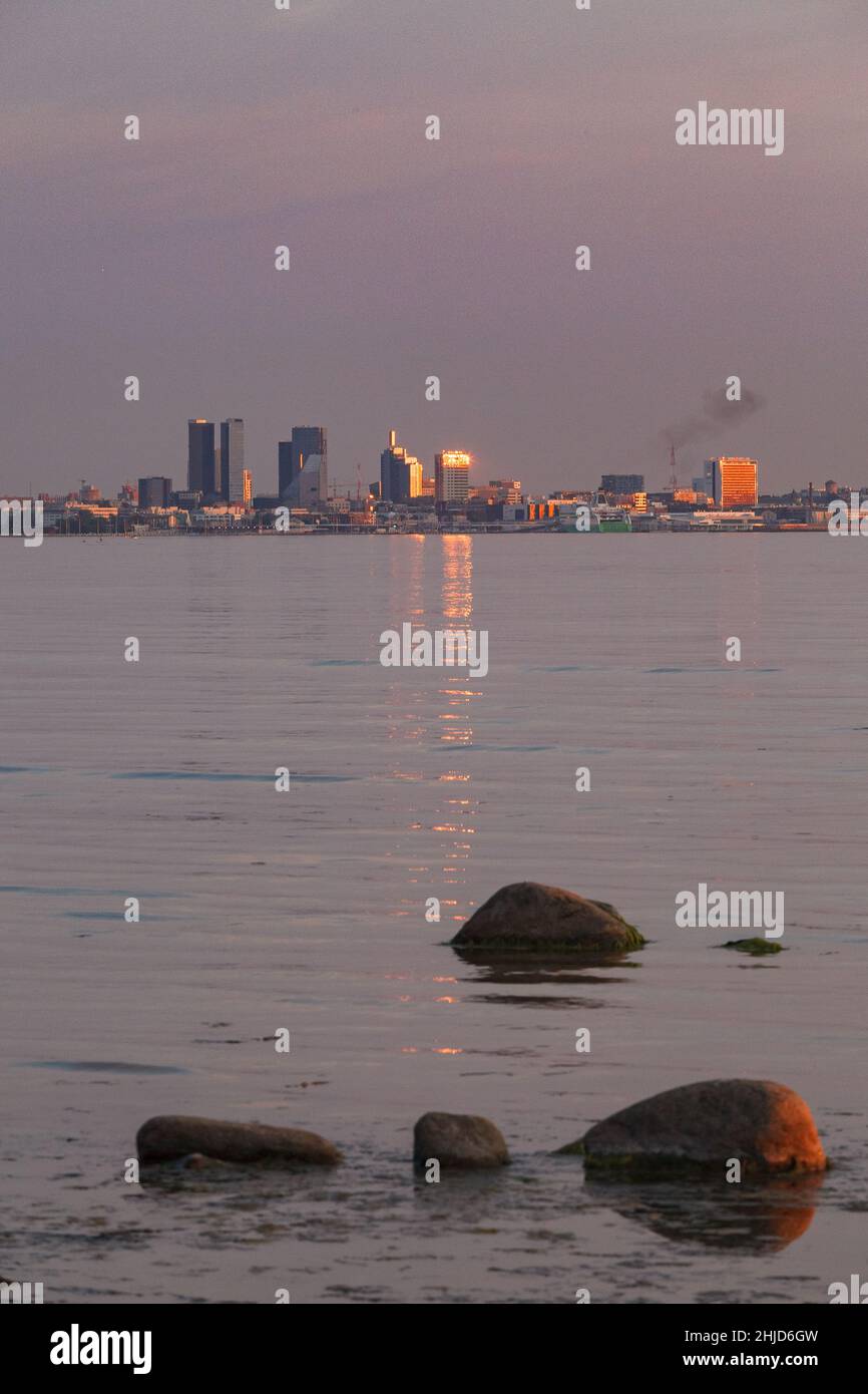 Beautiful scenic view of Tallinn old town from the sea at sunset ...