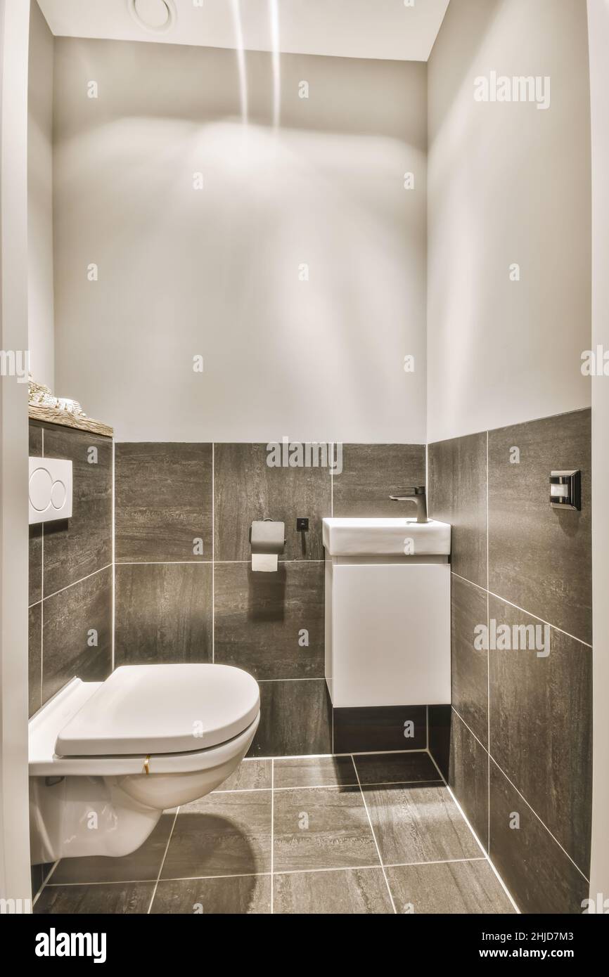 Interior of small clean restroom in miniature style Stock Photo - Alamy