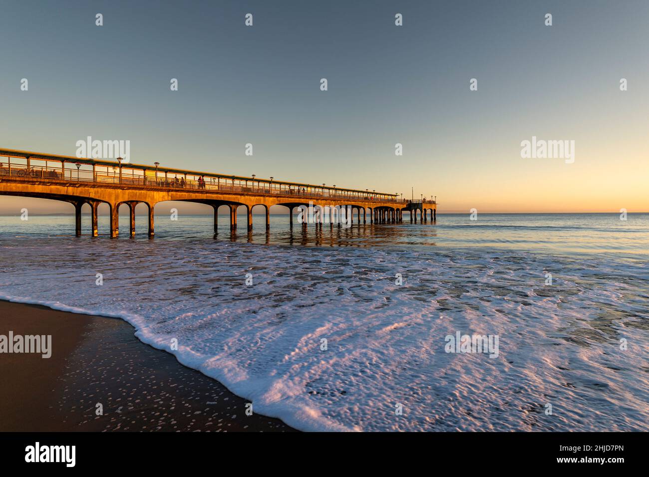 Pier in setting sun hi-res stock photography and images - Alamy