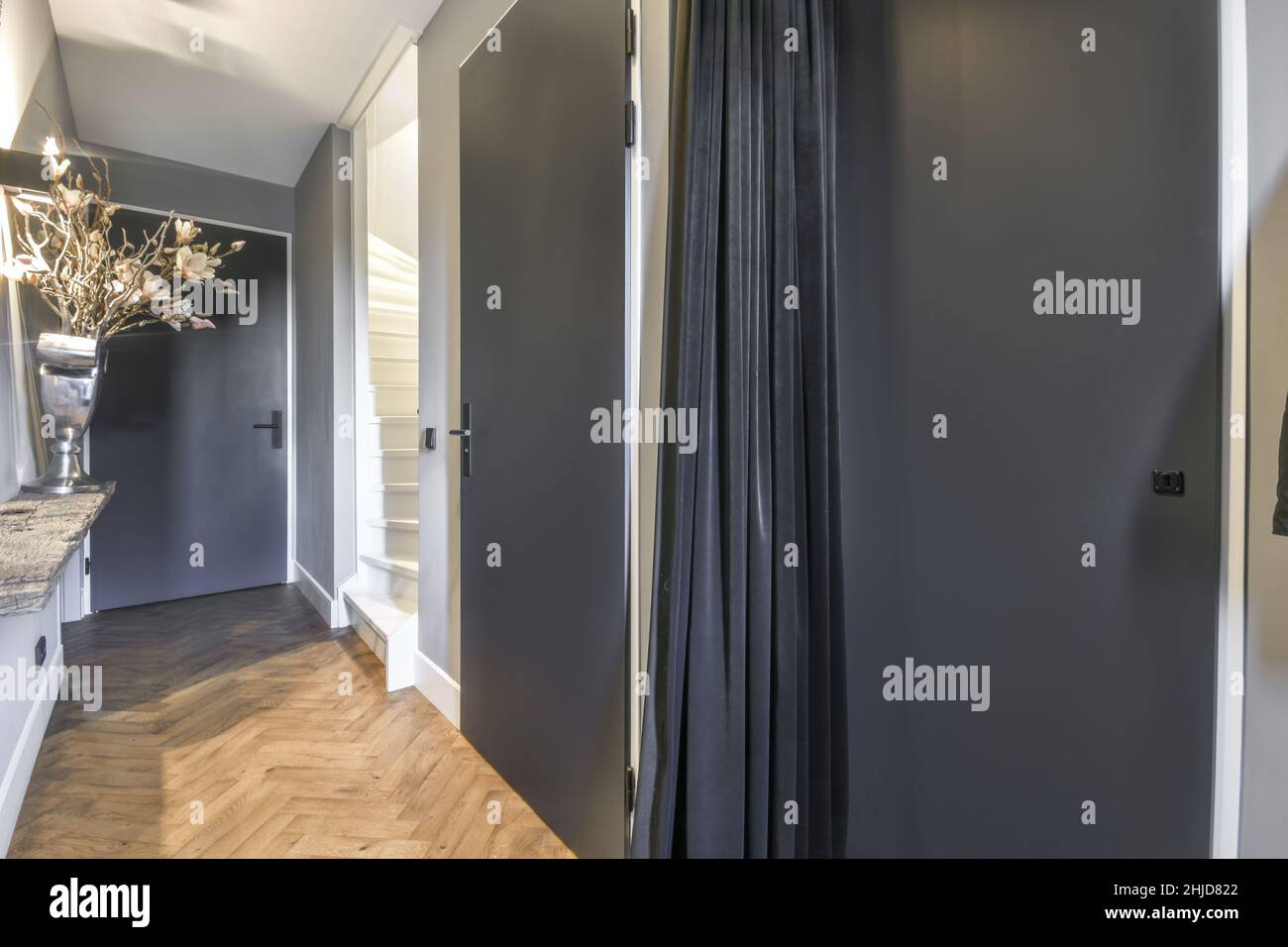 A long empty corridor designed in minimalistic style Stock Photo - Alamy