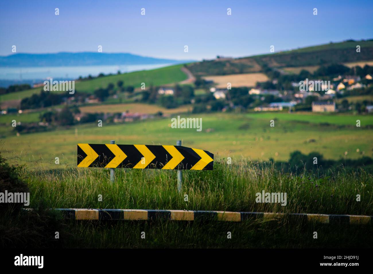 View of the striped sign with arrows showing the right way Stock Photo ...