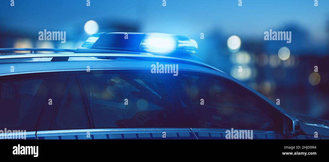 police on duty with blue lights Stock Photo - Alamy