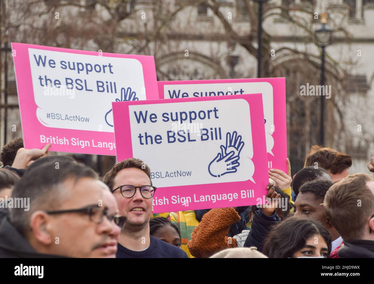 Protesters hold 'We Support the BSL Bill' placards during the rally ...