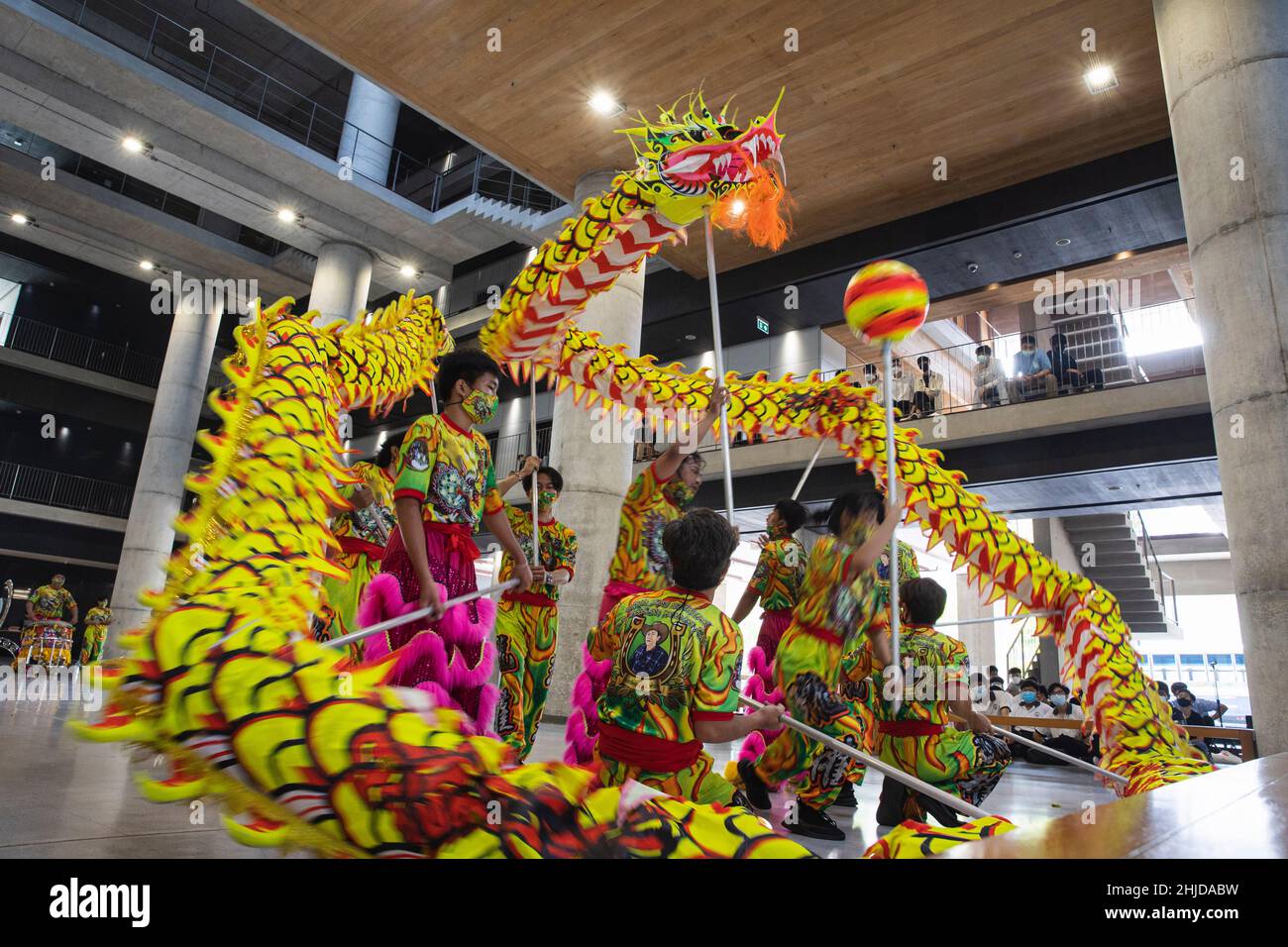 Long Qian dragon and lion dance crews perform a lion dance at the ...