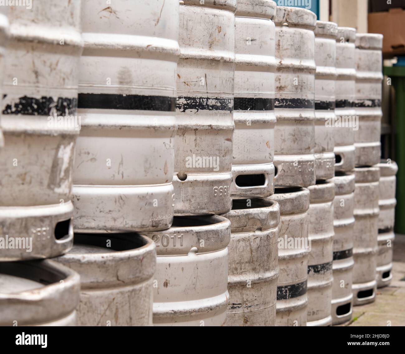 Aluminum beer barrels stacked on top of each other Stock Photo - Alamy