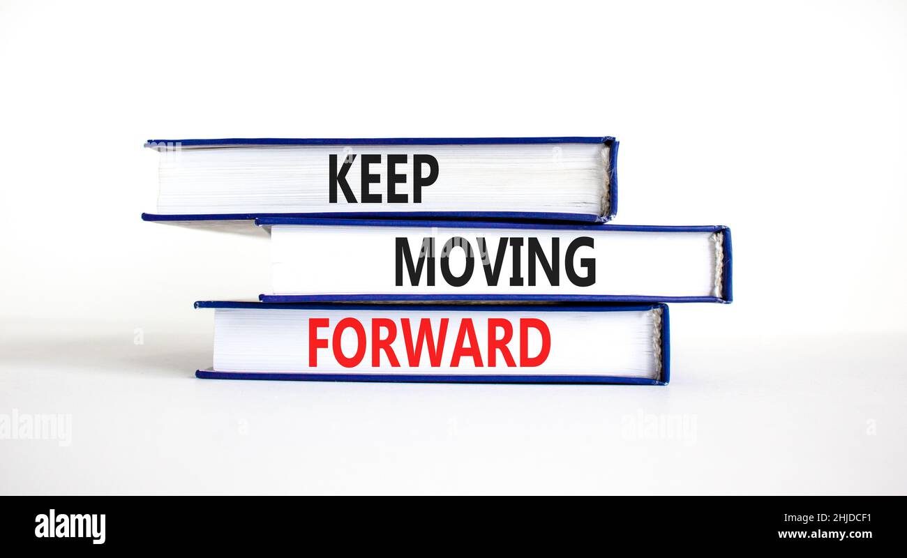 Keep moving forward symbol. Concept words Keep moving forward on books ...