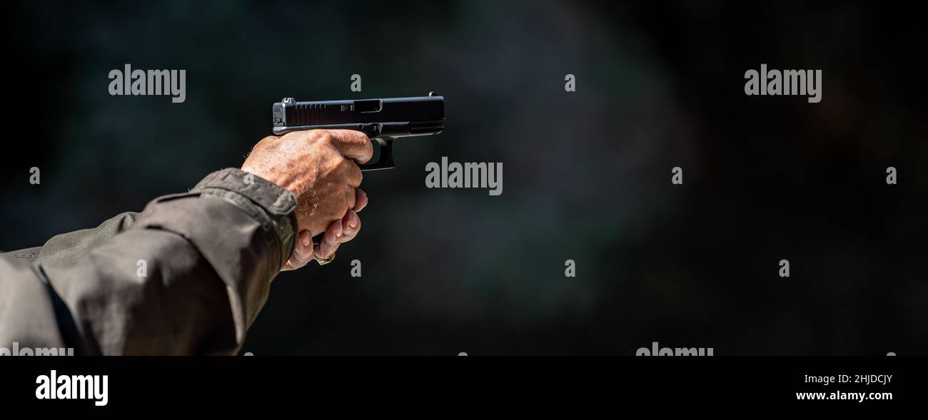 shooting from a pistol at a target on a shooting range. banner. copy ...