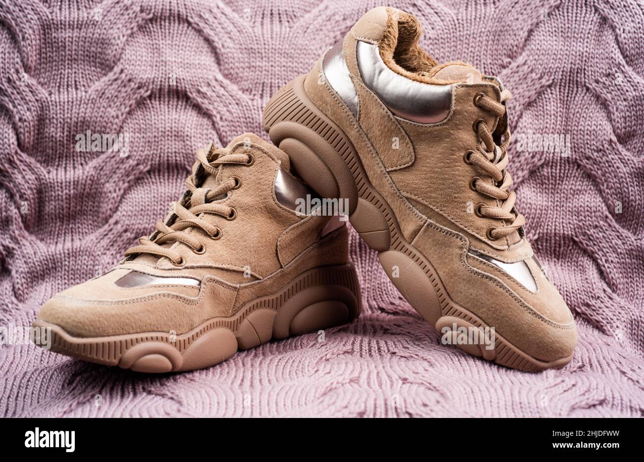 beige sport shoes on knitted background, sport fashion Stock Photo - Alamy
