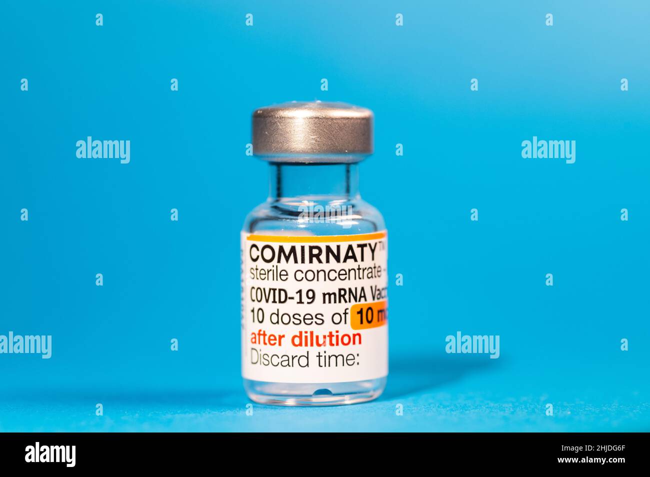 In this photo illustration a vial of COMIRNATY (Pfizer BioNTech ...
