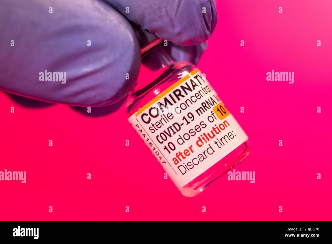 In this photo illustration a vial of COMIRNATY (Pfizer BioNTech ...