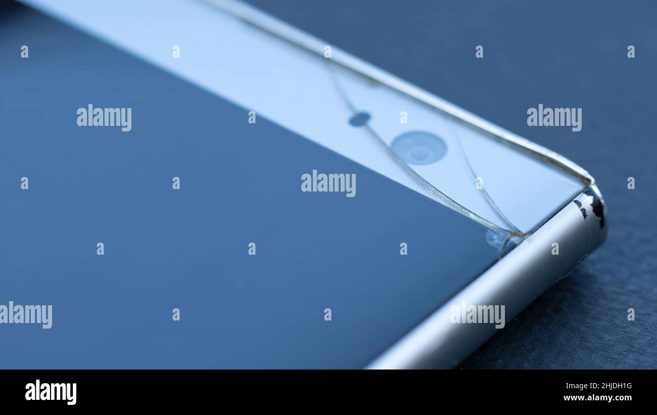 Crack on the smartphone screen macro photography. Broken touchscreen of ...