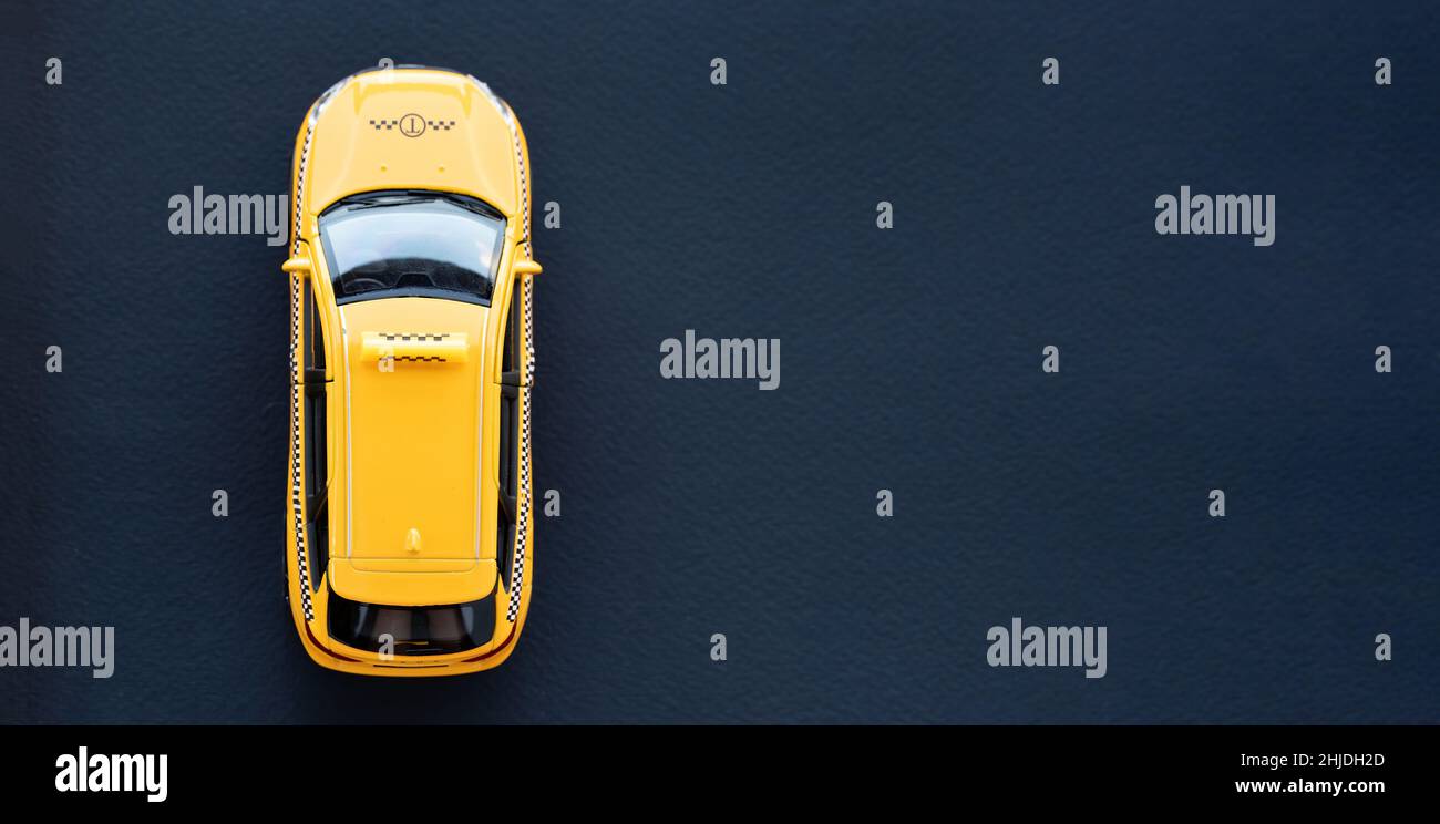 Yellow taxi car top view on a black background macro photography. Taxi ...