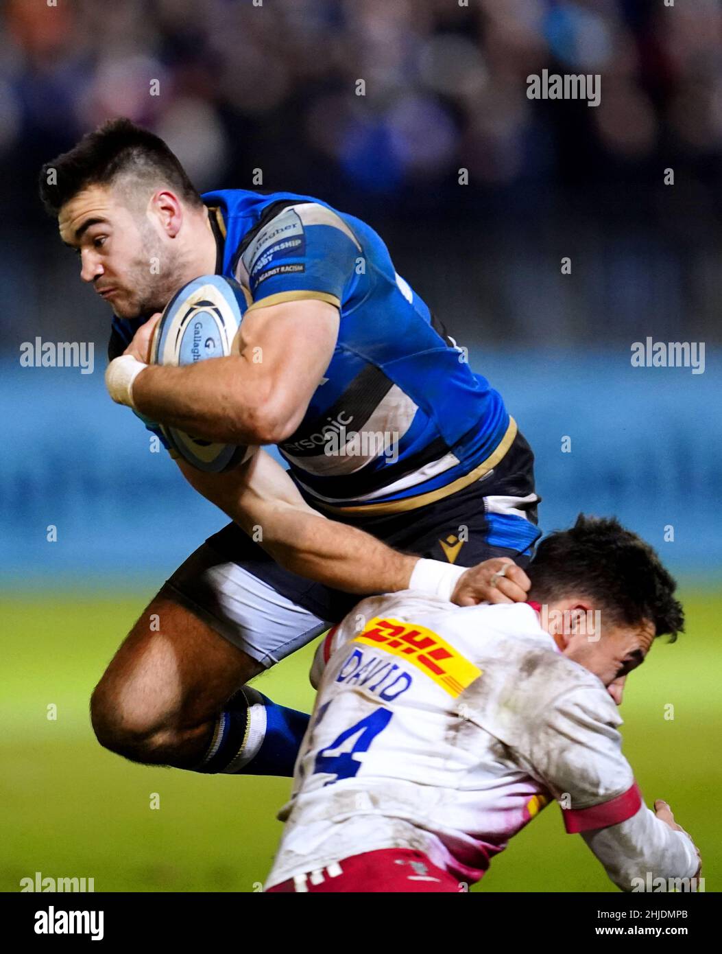 Bath Rugby's Will Muir (left) evades the tackle of Harlequins' Nick ...
