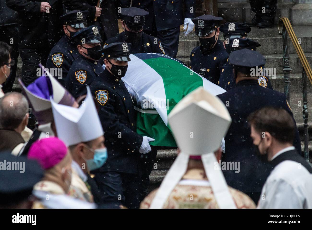 NYPD officers carry the casket of NYPD Officer Jason Rivera to the ...