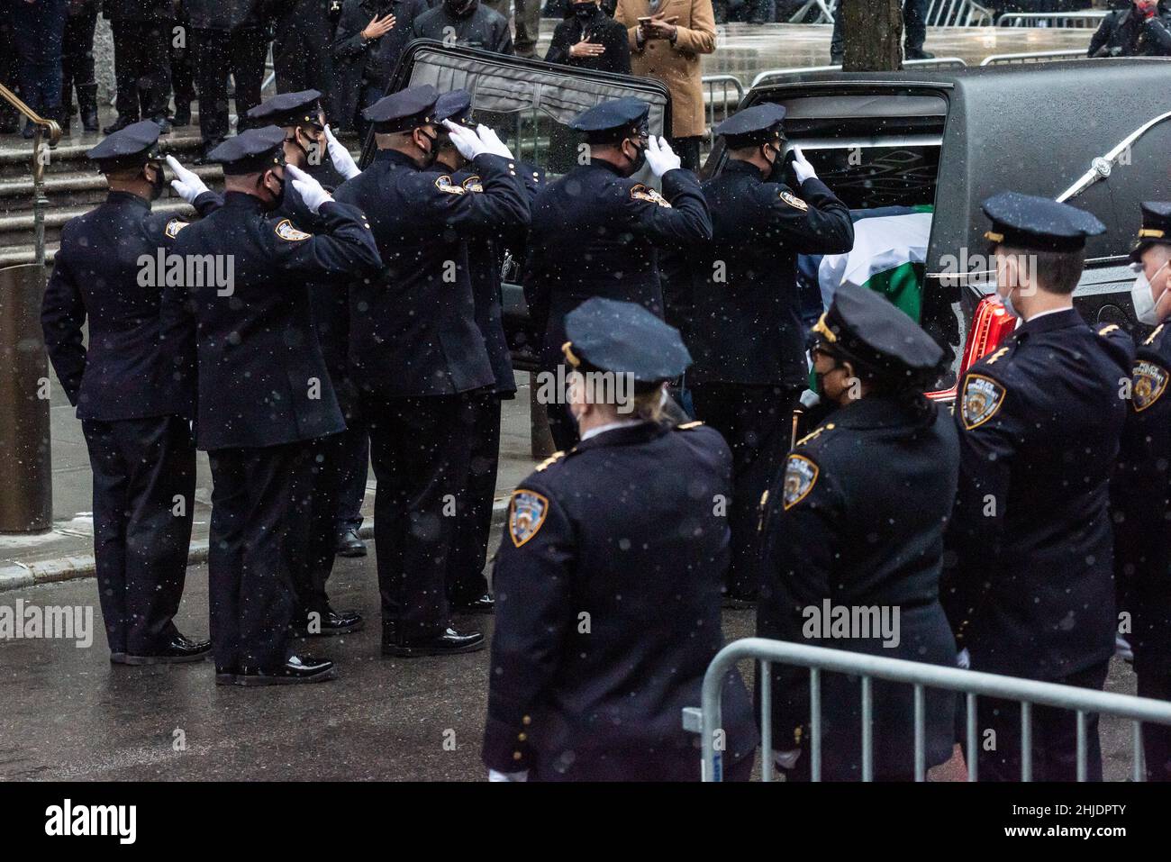 NYPD officers salute the casket of NYPD Officer Jason Rivera after his ...