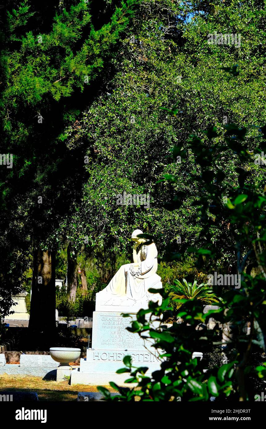 White Stone Statue Beyond Greenery Stock Photo - Alamy