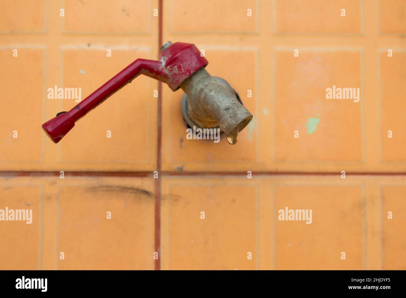 old faucet on concrete wall, save the water concept Stock Photo - Alamy