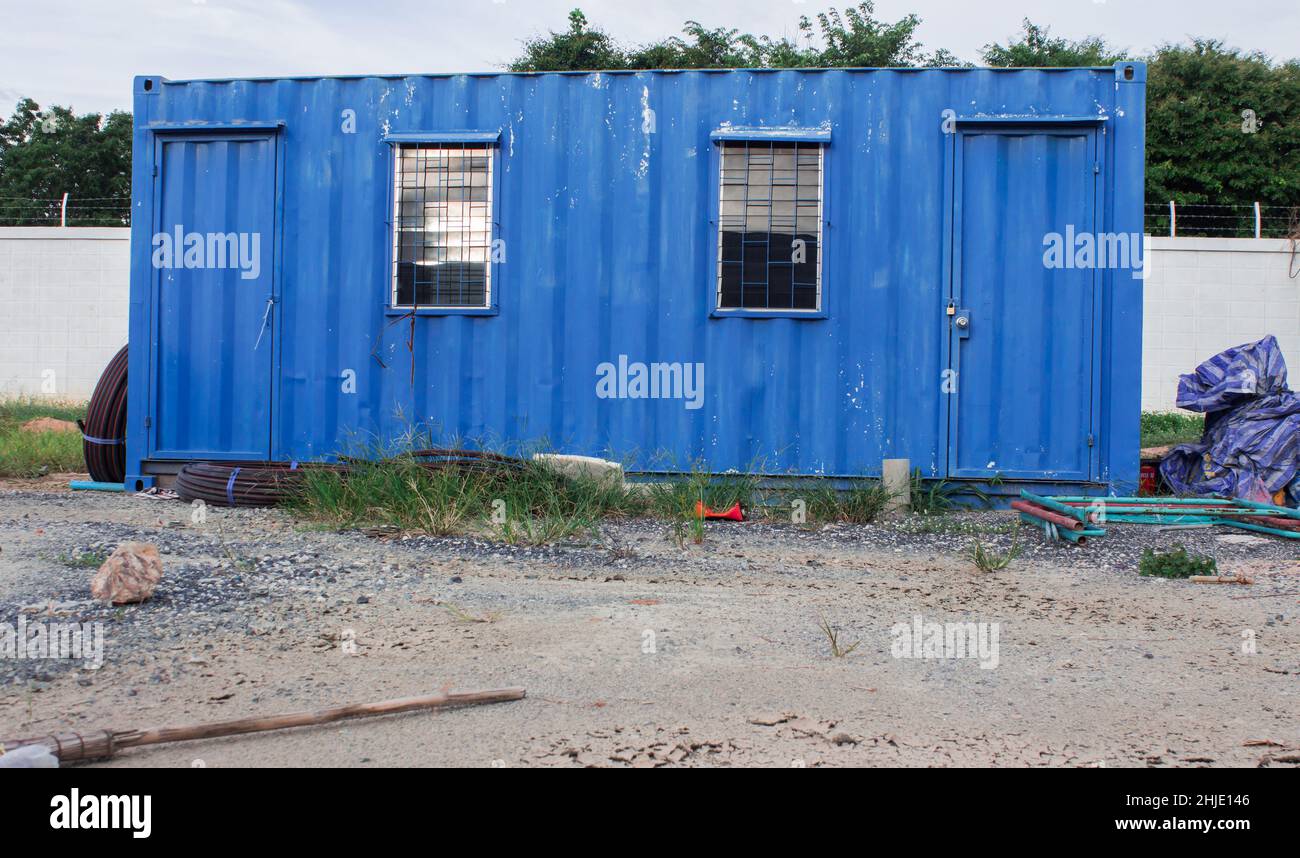 Blue color container house with door and window Stock Photo - Alamy